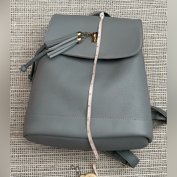 unbranded | Bags | Nwot Faux Leather Backpack With Tassel And Gold ...